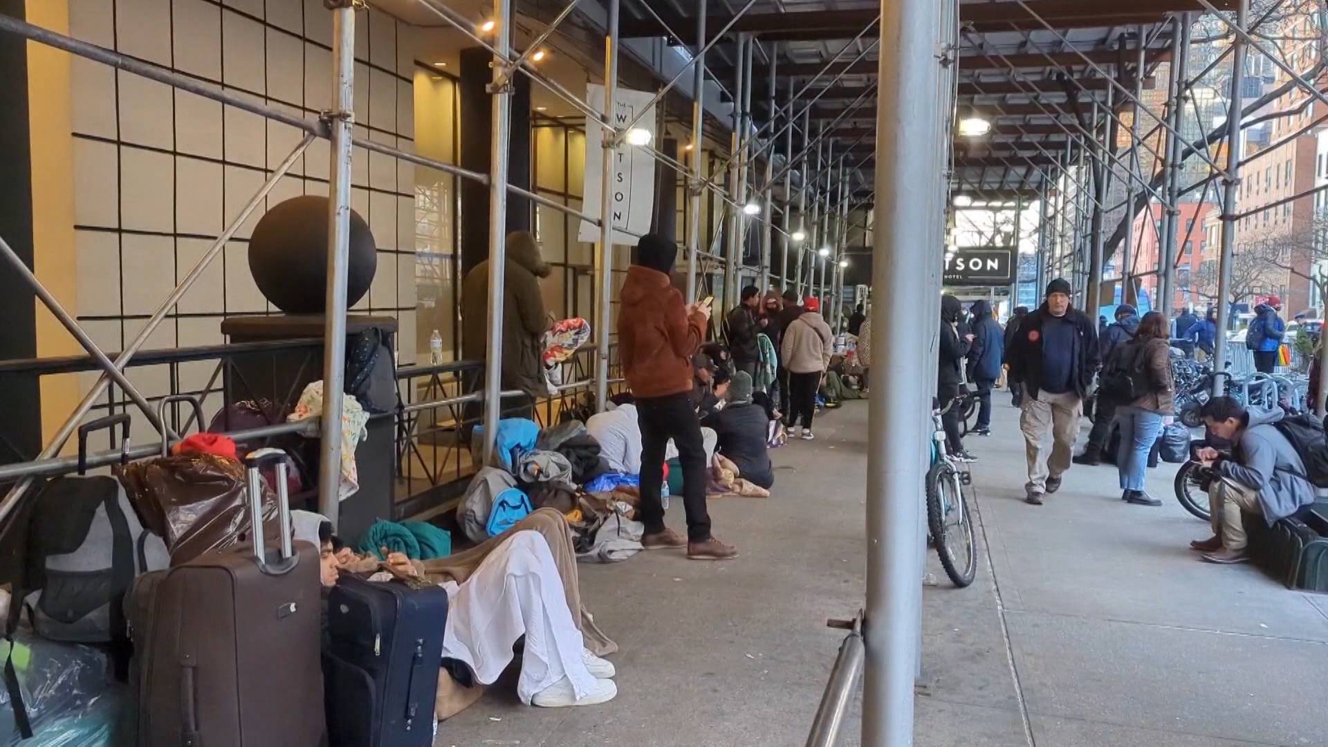 Standoff at NYC Hotel: Asylum Seekers Protest Relocation & Demand Their ...